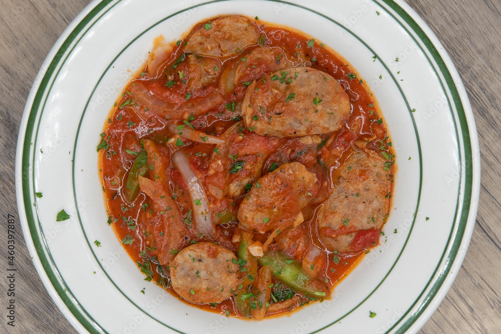 Overhead view of bowl of salsiccia peperoni arrosto served in a bowl ...