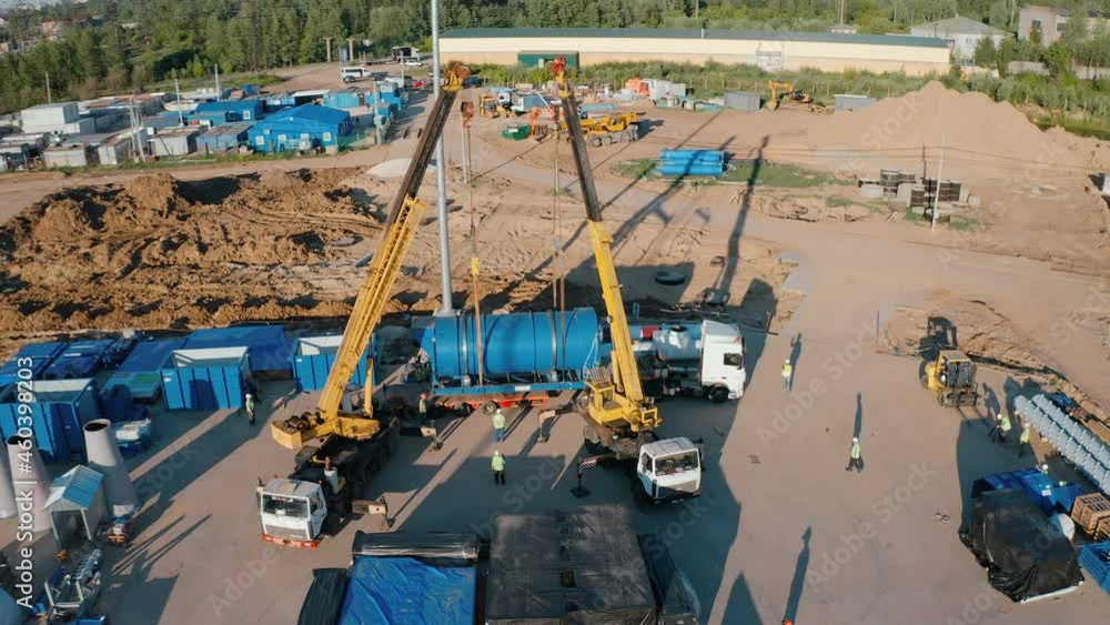 A semi-truck carrying a huge powerful and heavy industrial equipment ...