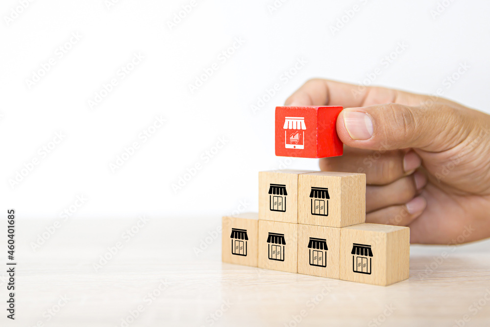 Franchise e-commerce, Hand choose cube wooden block stack with ...