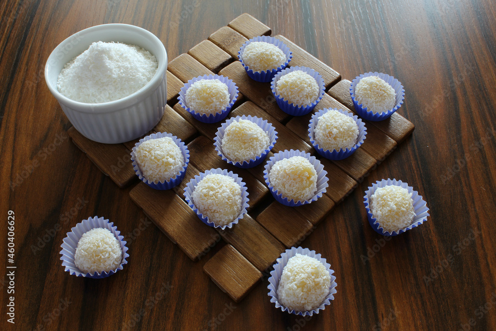 Beijinho candy. Brazilian traditional sweet called beijinho and portion ...