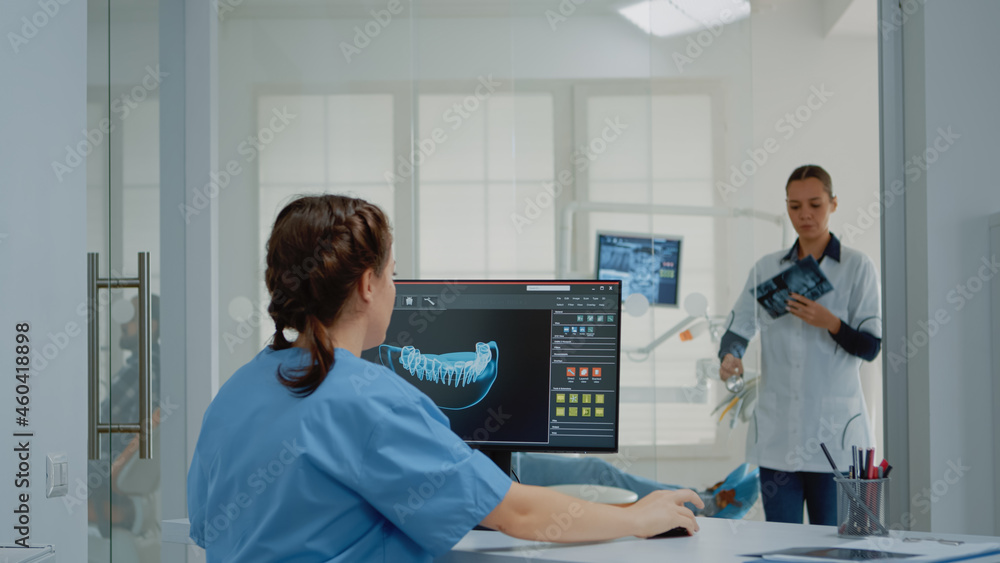 Dentistry assistant using computer with virtual teeth animation while ...