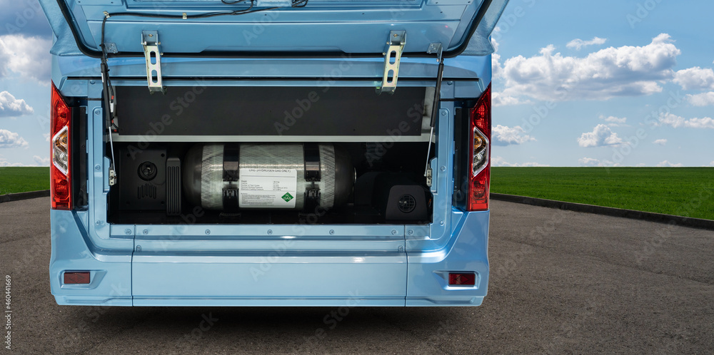 A hydrogen fuel cell bus with an open hood and a hydrogen tank inside ...