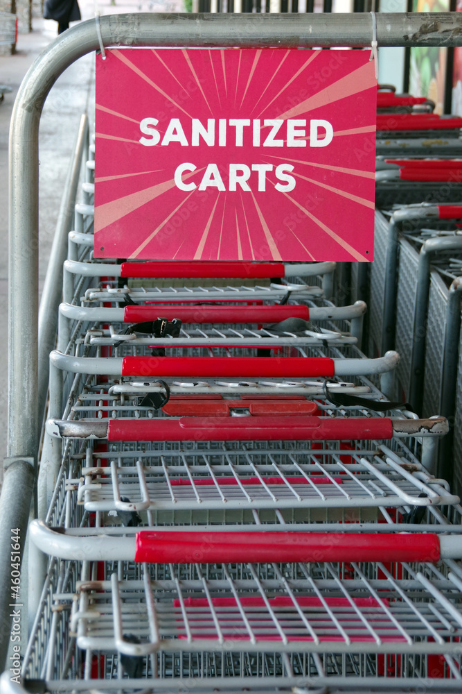 SANITIZED CARTS sign marking sanitized shopping carts in front of a ...