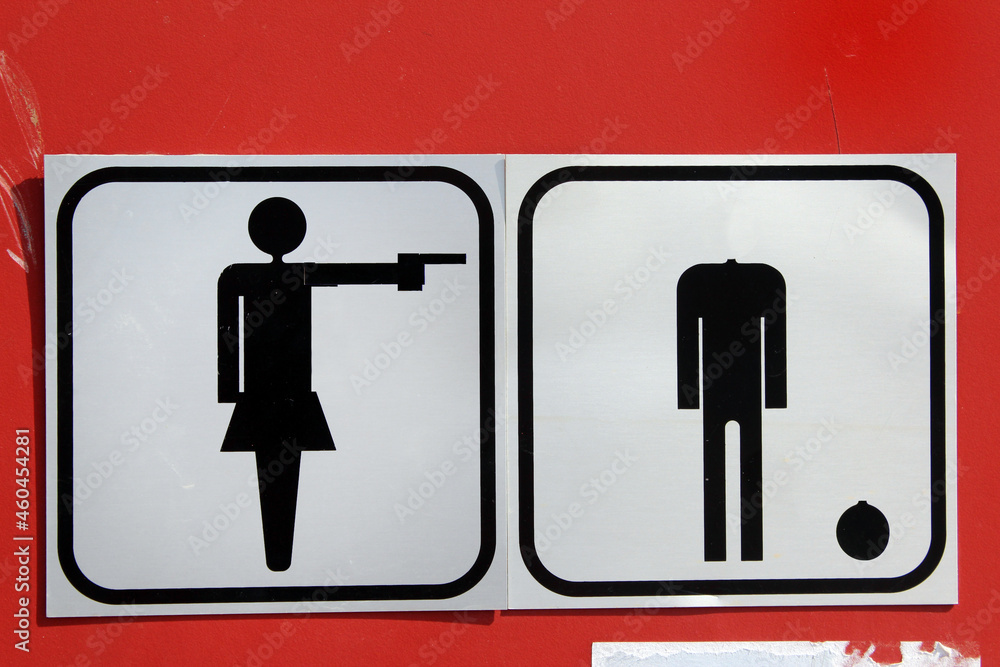 WC toilet sign with women pointing at beheaded man printed over red ...