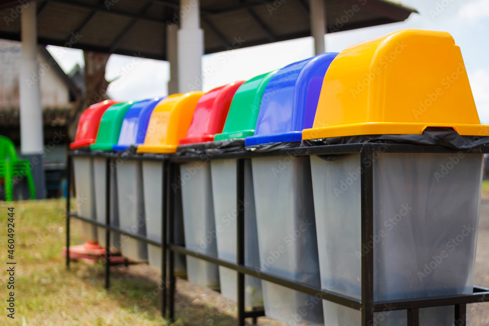 The multi-colored bins are arranged next to each other as bins for ...