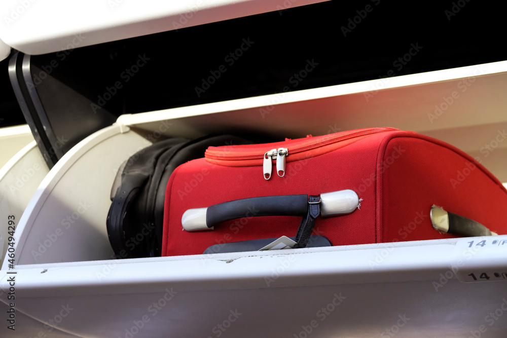Cabin baggage in an overhead stowage compartment of an airplane Stock ...
