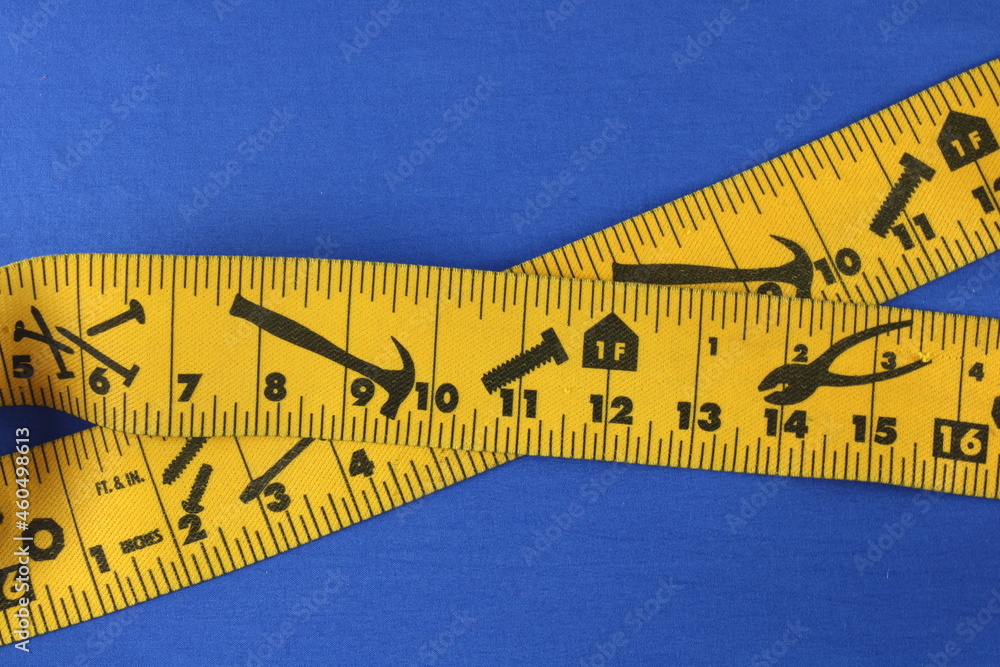 Workman's tape measure securing straps with images of hammer, pliers ...
