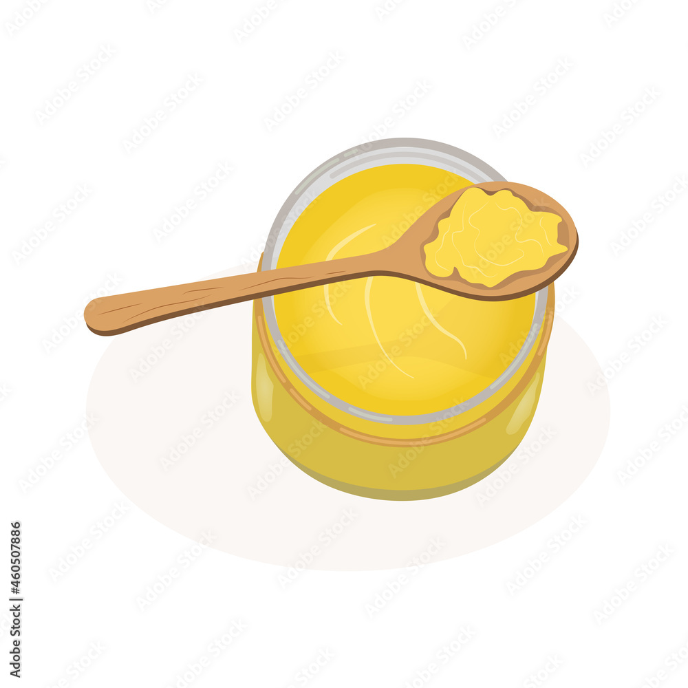 Ghee oil in a jar top view. A wooden spoon with ghee butter lies on a ...