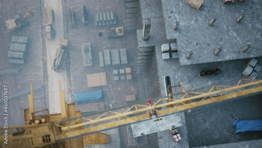 Work of a tower crane at a construction site. High crane works on ...