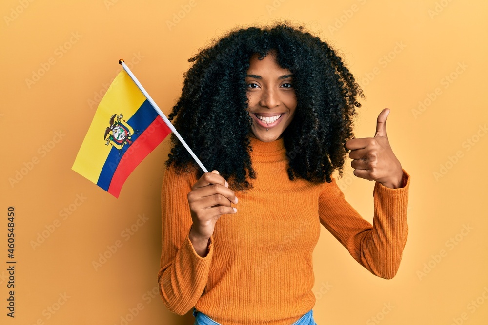 African american woman with afro hair holding ecuador flag smiling ...