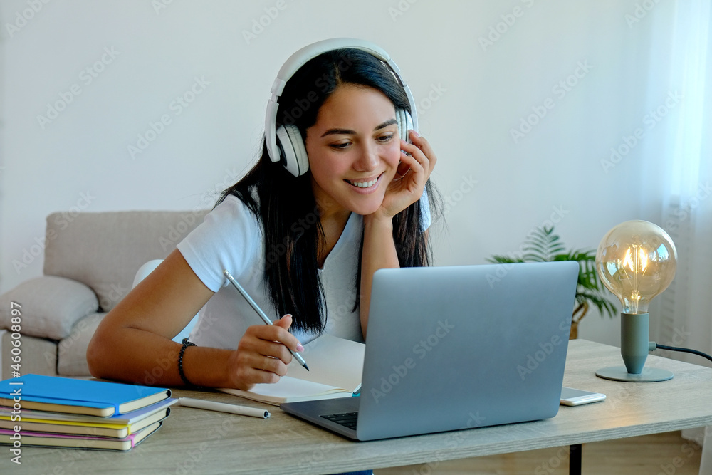 Online education concept. Young beautiful brunette woman watching an ...