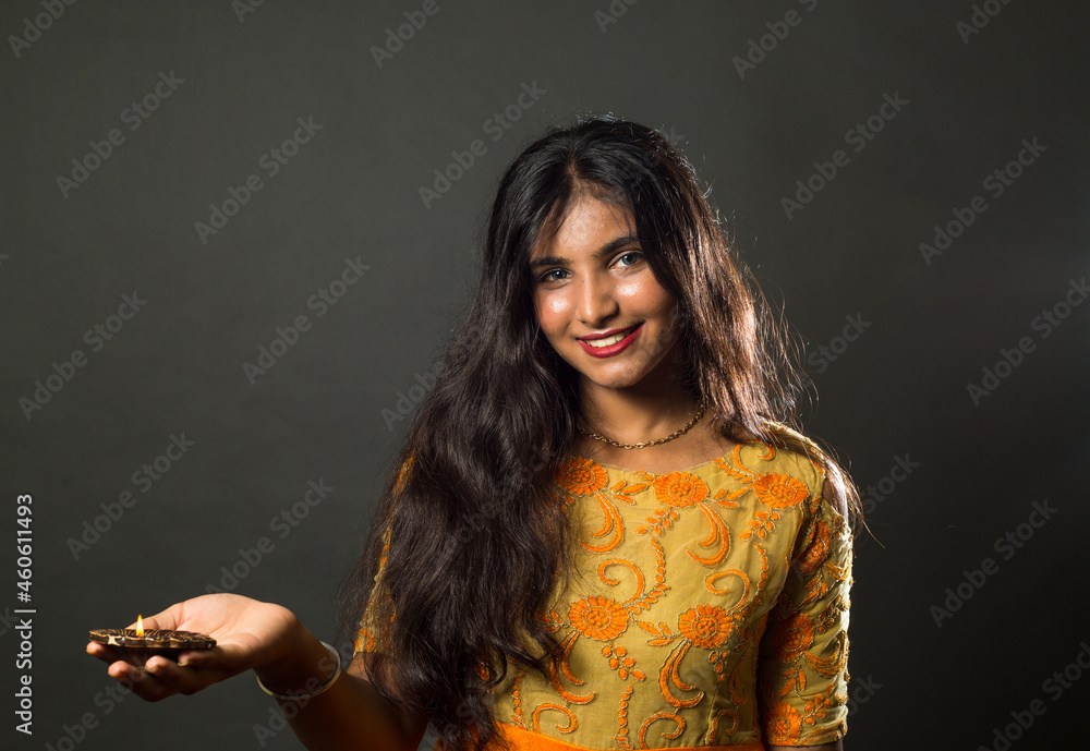 Beautiful Indian Girl in indian Traditional dress holding Diwali diya ...