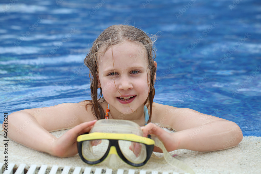 Child playing in pool. Little girl having fun in the pool. Summer ...
