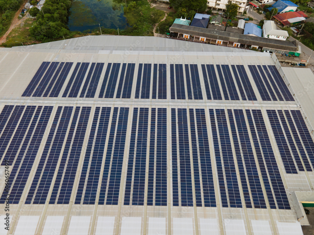 Aerial drone image of solar panels installed on a roof of a large ...