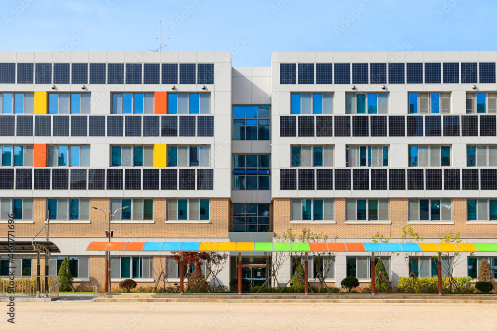 Building solar panels. Solar elementary school building. Eco-friendly ...