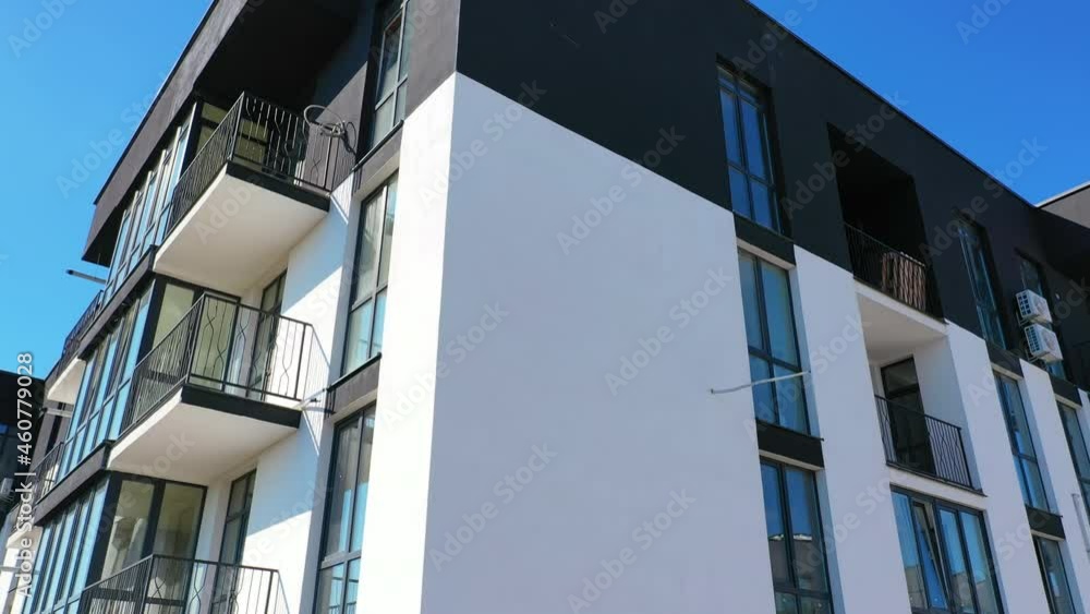 Block of flats on sky background. Modern high-rise apartment building ...