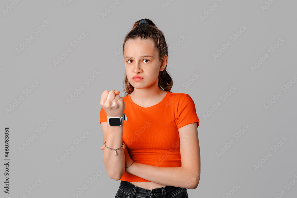 Angry brunette teen girl showing fist, sulking angry and tensed ...