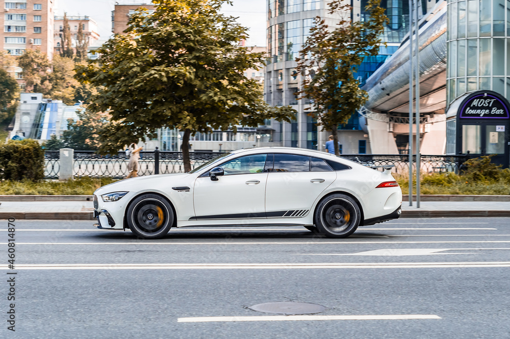 Mercedes-AMG GT 63 S 4-door coupe car on the street. Side view of white ...