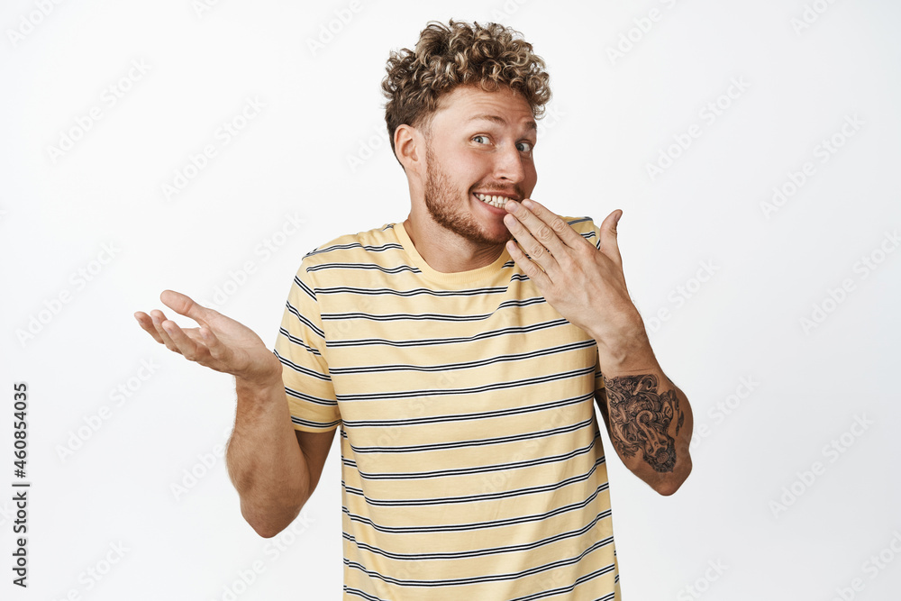 Oops sorry. Cute blond guy shrugging shoulders and cover his smile with ...