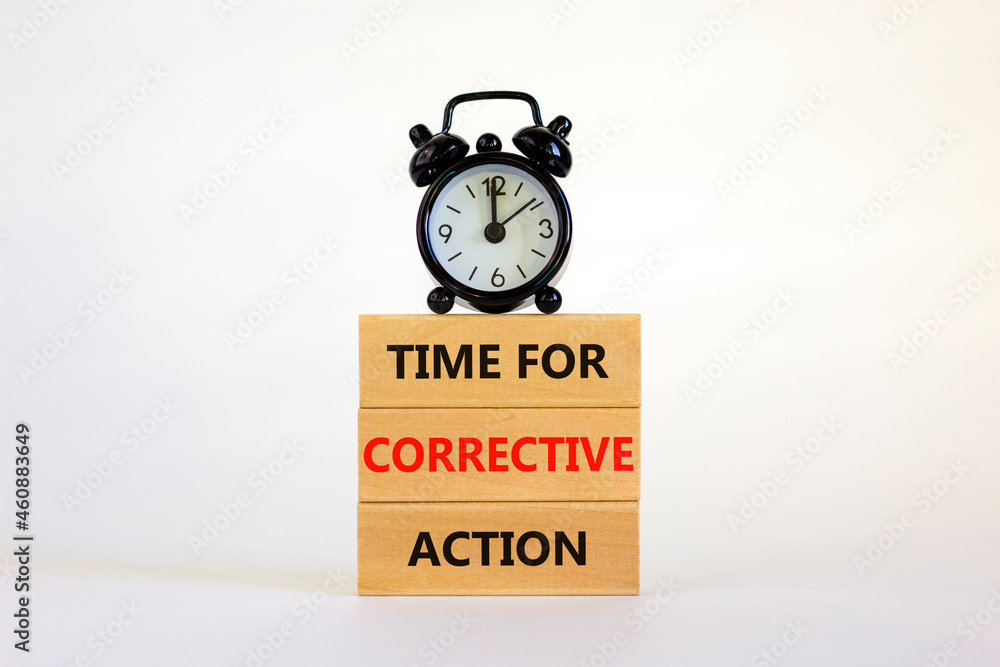 Time for corrective action symbol. Wooden blocks with words 'Time for ...