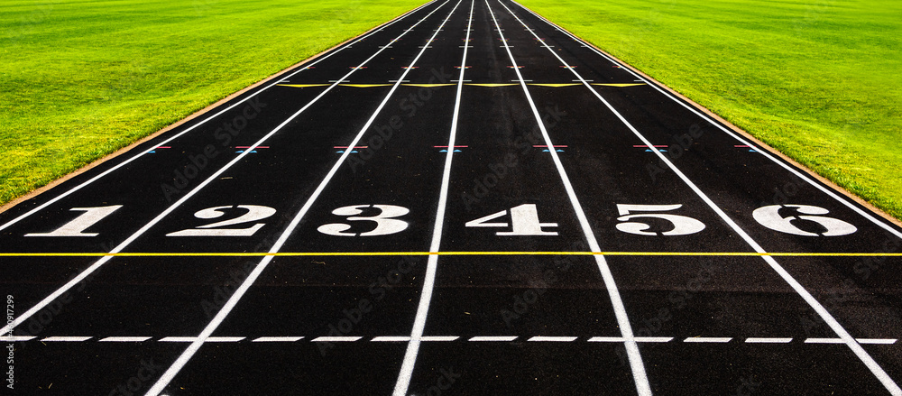 All-weather black rubber running track with numbers for athlete, depth ...
