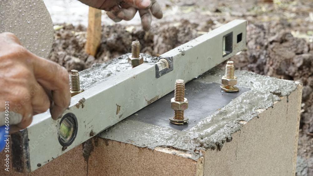 Construction work, worker building construction. making the pillar ...