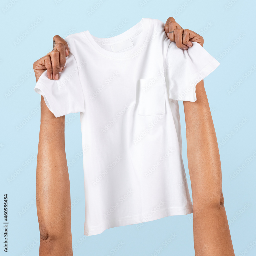 Hand holding t-shirt kids apparel Stock-Foto | Adobe Stock