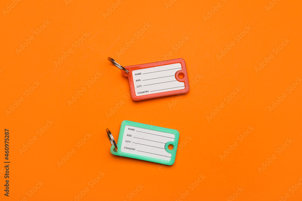 New plastic key tags on orange background Stock Photo | Adobe Stock