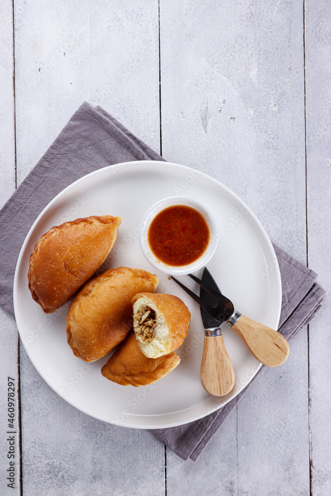 Panada is a fried bread filled with spicy tuna, a traditional snack ...
