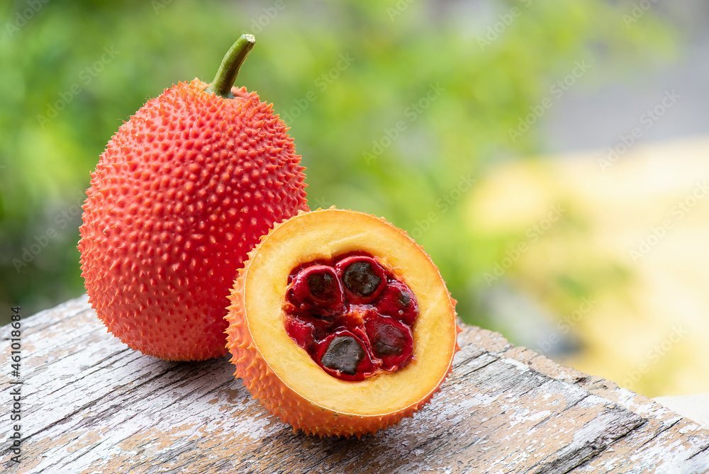 Gac fruits and half natural background. Stock Photo | Adobe Stock