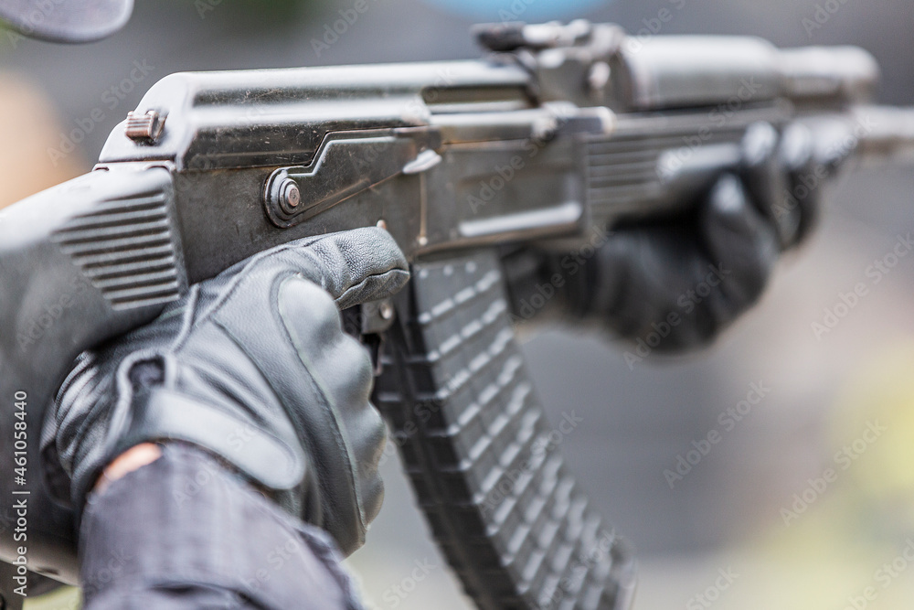automatic weapon, pistol in the hands of a well-equipped and trained ...