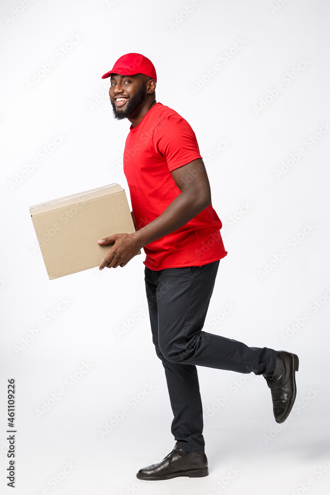 Portrait of Happy African American delivery man in red cloth walking to ...