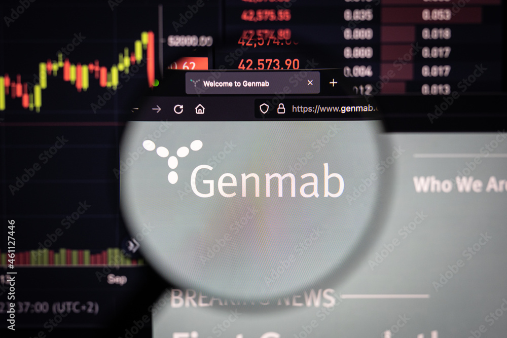 Genmab company logo on a website with blurry stock market developments ...