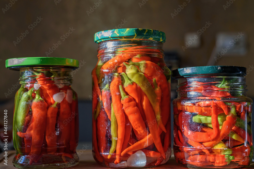 Canned pods of bitter pepper. Chili pepper. Agricultural background ...