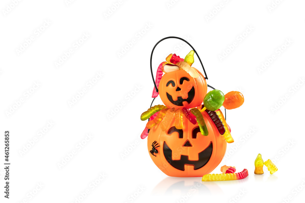 Big and small orange pumpkin jack-o-lantern baskets full of candies ...