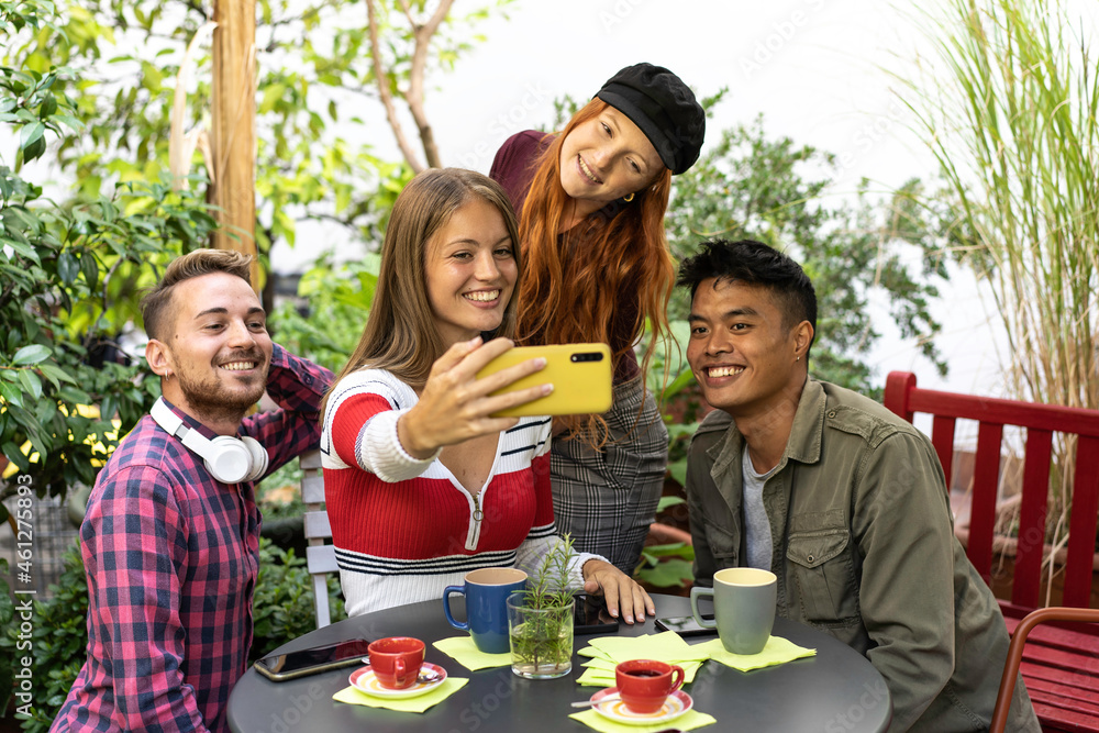 Multicultural happy friends having fun taking group selfie portrait ...
