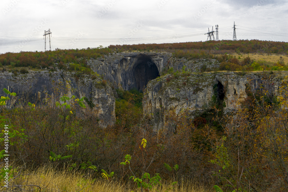 Panoramic view of entrance of Prohodna cave also known as God's eyes ...