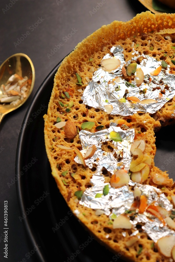 Rajasthani Ghevar. Ghewar is an Indian crunchy sweet dish made using ...