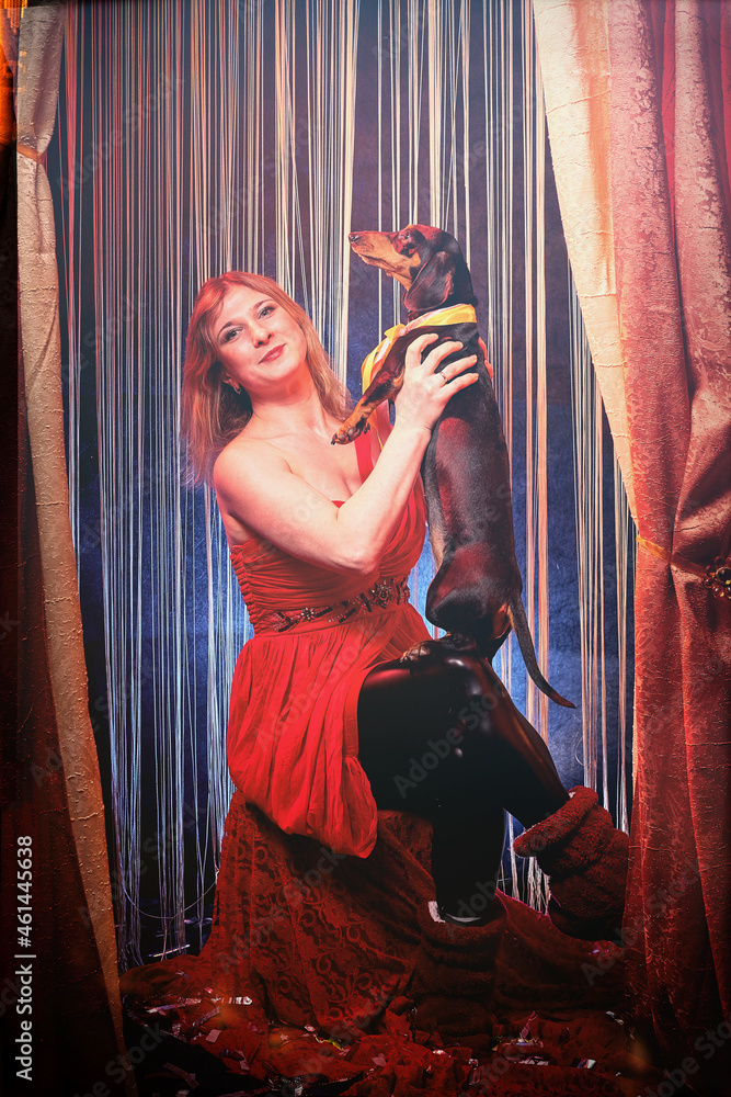 Woman during a stylized theatrical circus photo shoot in a beautiful ...