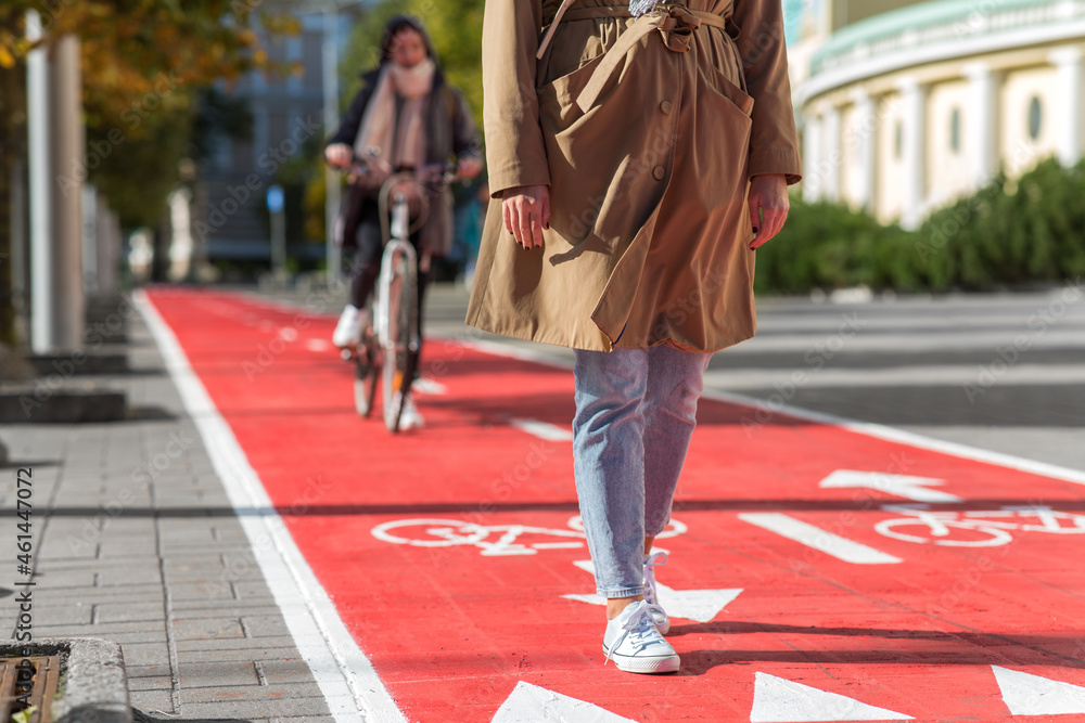city and traffic concept - close up of woman walking along separate ...