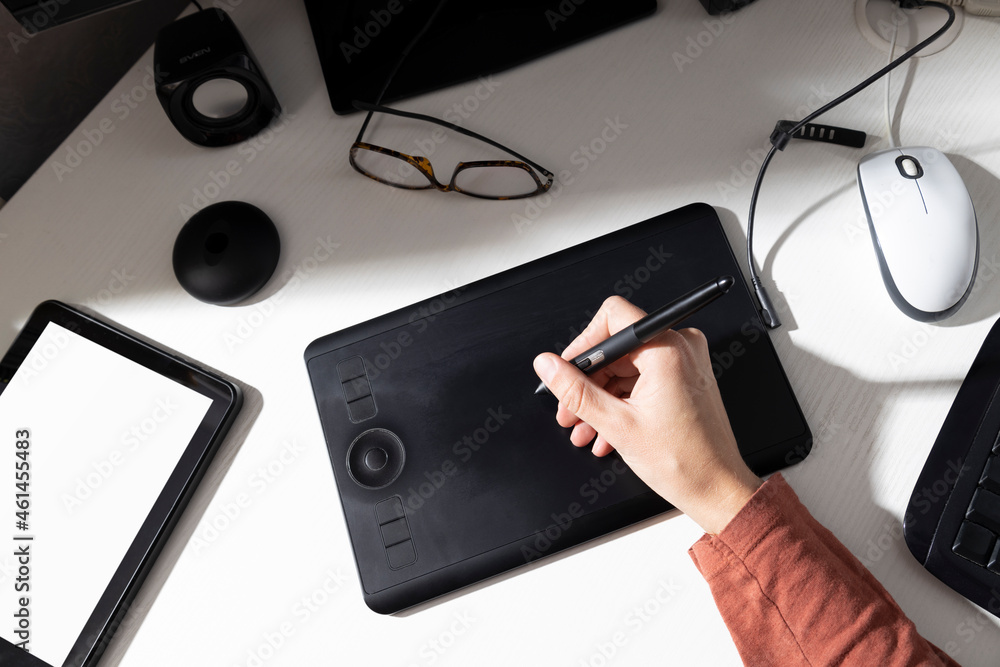 Top view of office desk and drawing tablet, keyboard,pc tablet ...