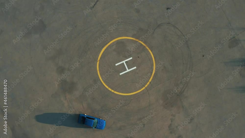 Ariel overhead shot drift sports car in a circle. Ariel overhead shot ...