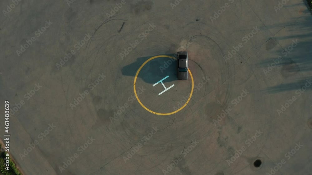 Ariel overhead shot drift sports car in a circle. Ariel overhead shot ...