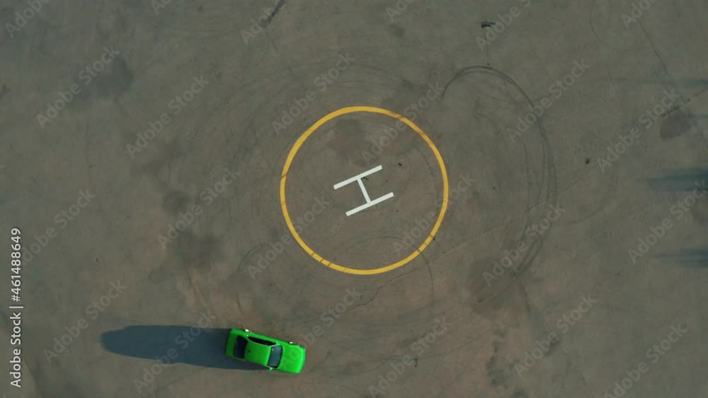 Ariel overhead shot drift sports car in a circle. Ariel overhead shot ...