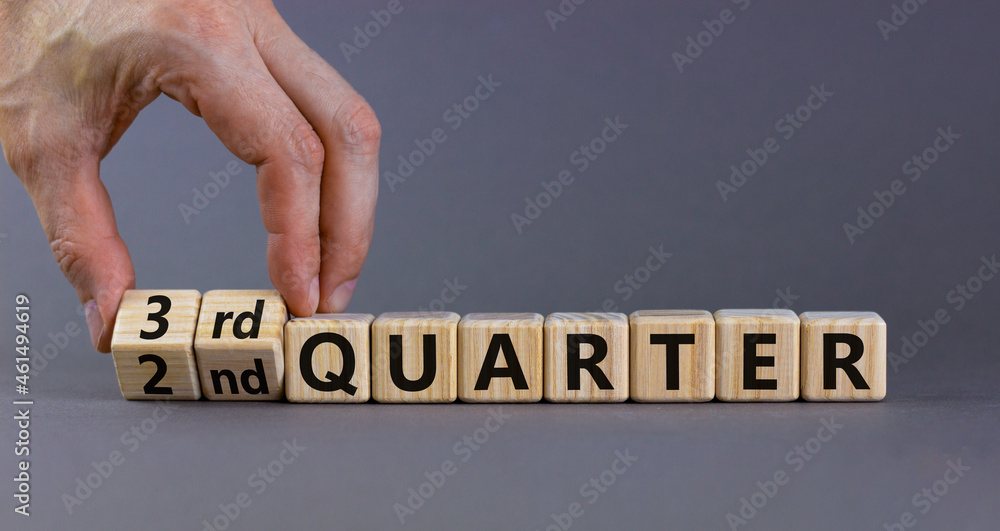 Foto Stock From 2nd to 3rd quater symbol. Businessman turns cubes and ...