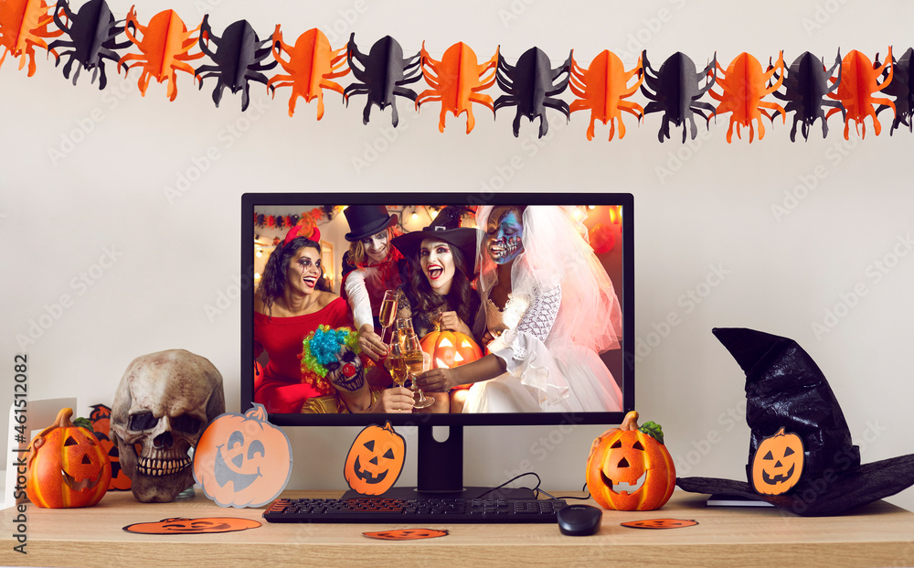 Computer with photo of happy diverse friends celebrating at virtual ...