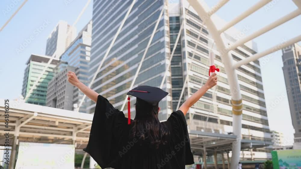 Video Stock Back view of beautiful young woman in graduation gowns ...