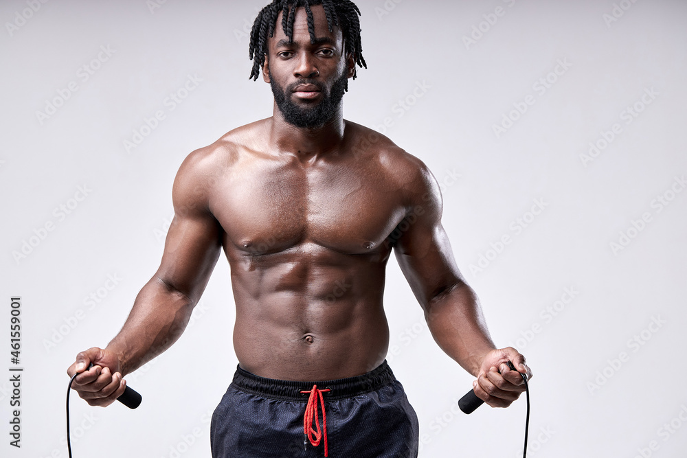 Shirtless Sweaty African Man Holding Skipping Rope In Hands Preparing To Jump Exercising