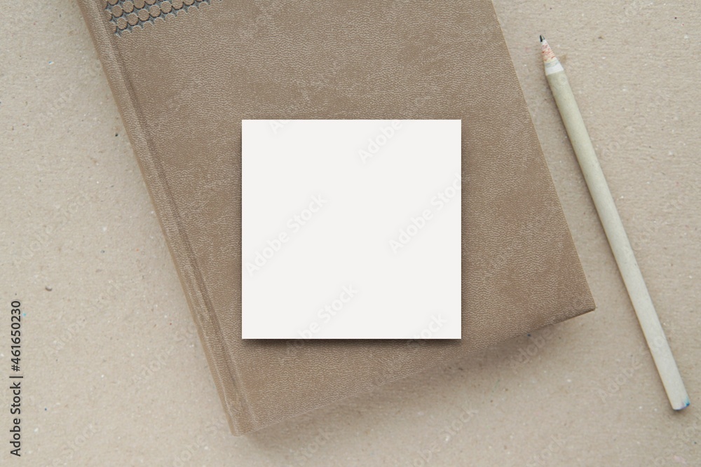 Small square notepad or sticky notes mockup on brown background, card ...