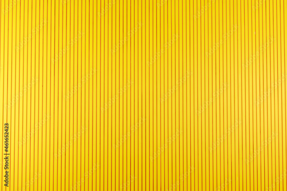 Bright vivid Pantone yellow vertical steady stripes straight lines ...